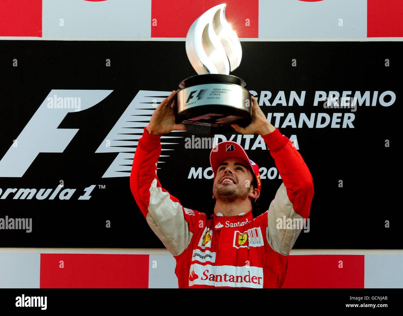 Ferrari's Fernando Alonso of Spain celebrates on the podium after ...