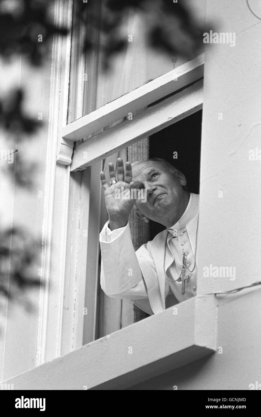 Pope John Paul II waves from the window of the Archbishop's House ...