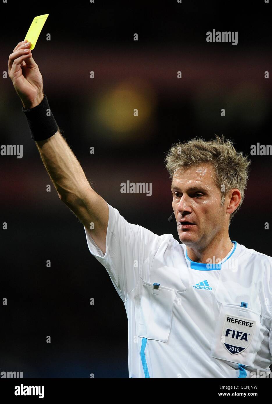 Referee alain hamer shows a yellow card hi-res stock photography and ...