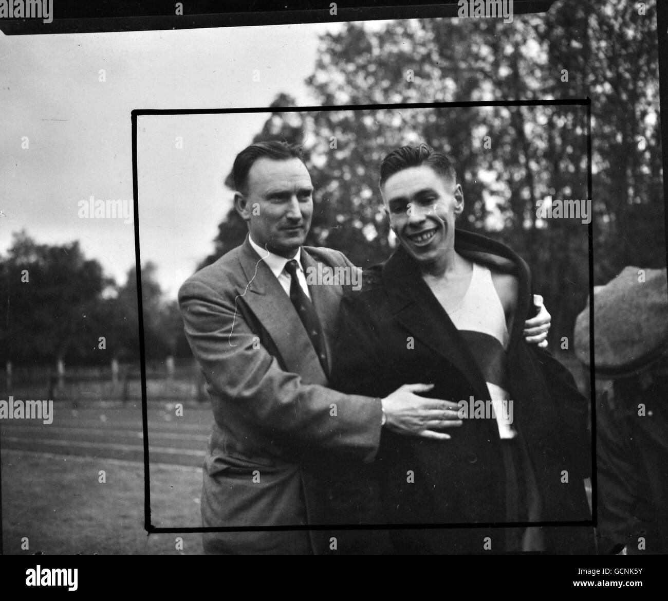 Marathon runner jim peters left congratulates a happy joe lancaster hi ...