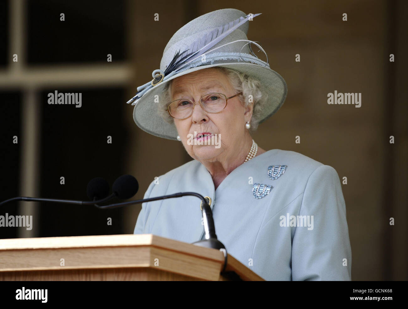 Britain's Queen Elizabeth II addresses a crowd in the gardens at the ...