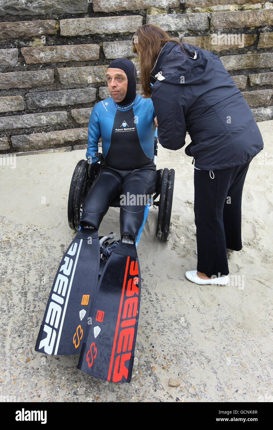 Frenchman Philippe Croizon is fitted with prosthetic legs with flippers ...