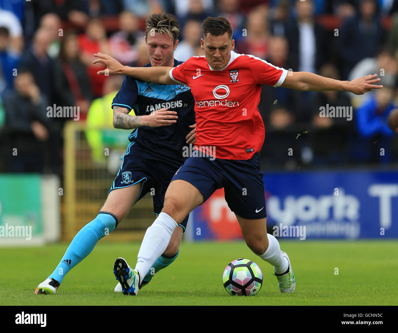 York City's Scott Fenwick (front) and Middlesbrough's Jordan McGhee ...