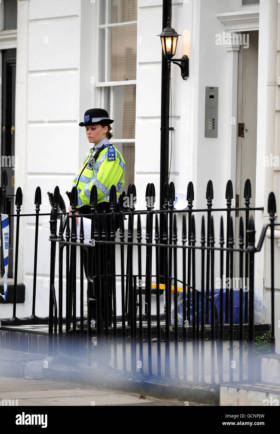 A PCSO stands outside a building where the body of an unnamed man was ...