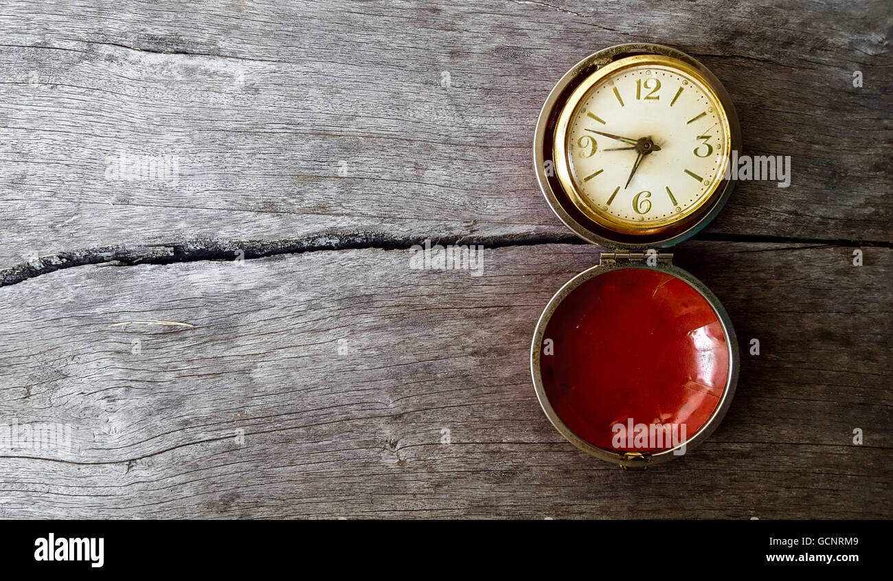 Beautiful red pocket watch on wooden background, vintage style Stock ...
