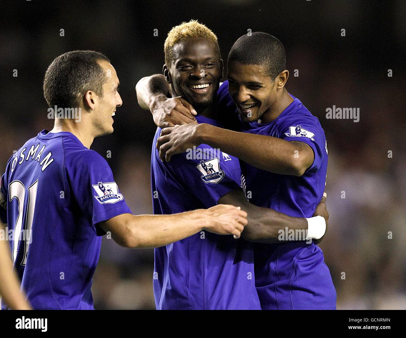 Everton's Louis Saha (centre) celebrates with team mates Leon Osman ...