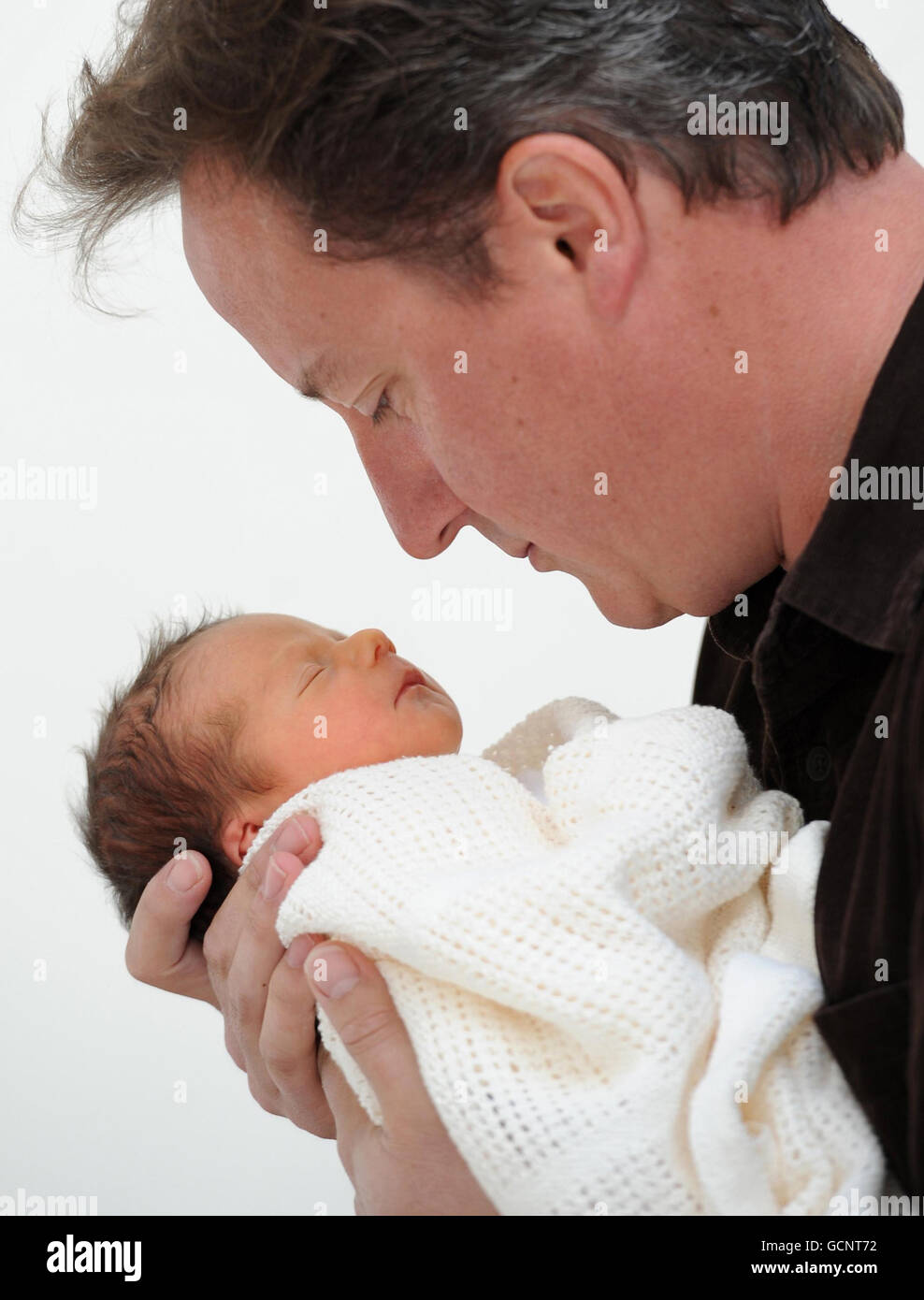 Previously unreleased photo of Prime Minister David Cameron holding his ...