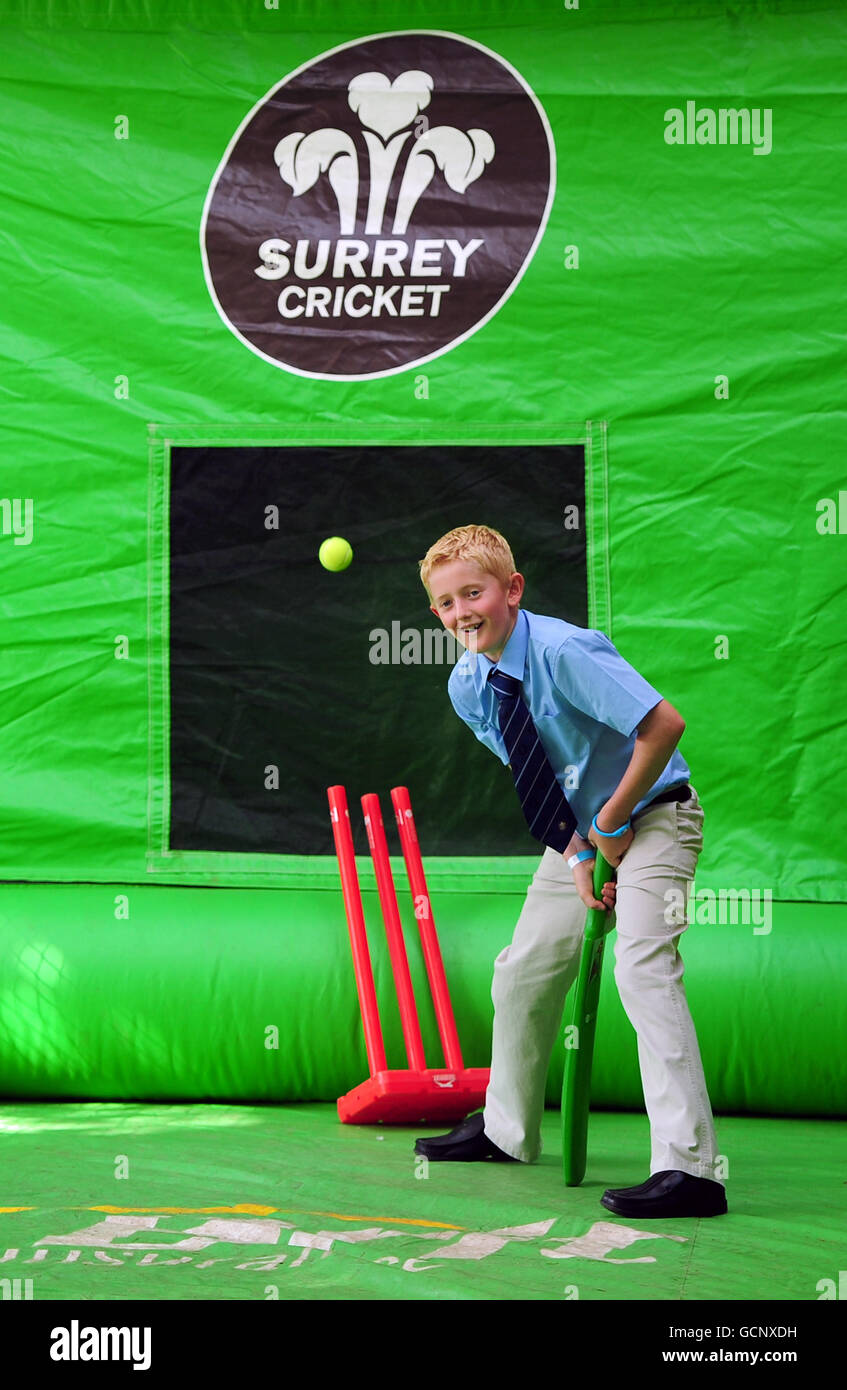 Kids play in inflatable set of nets around the ground hi-res stock ...