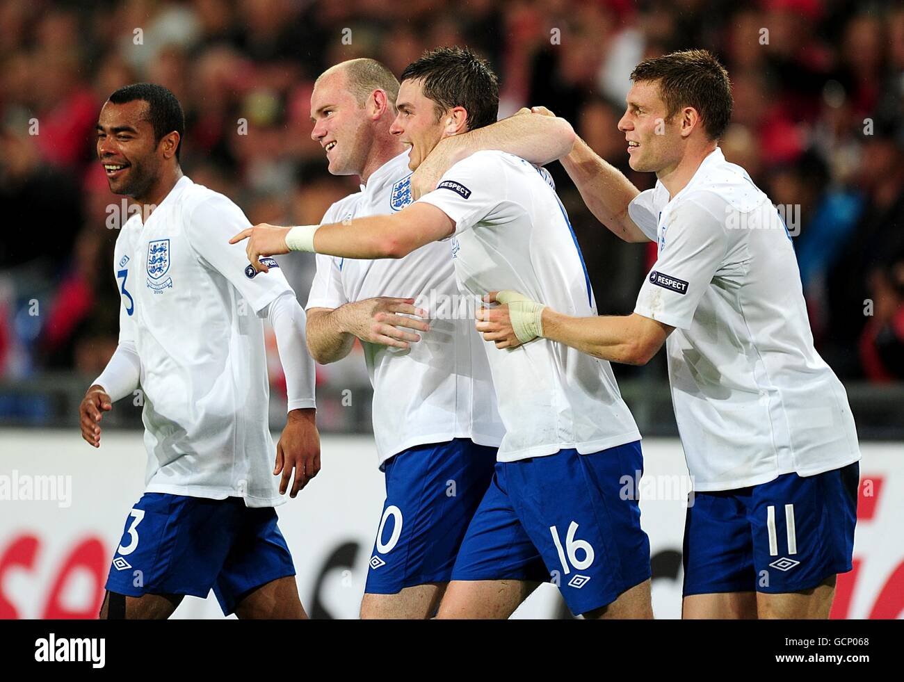 England's Adam Johnson (centre) celebrates with his team mates after ...