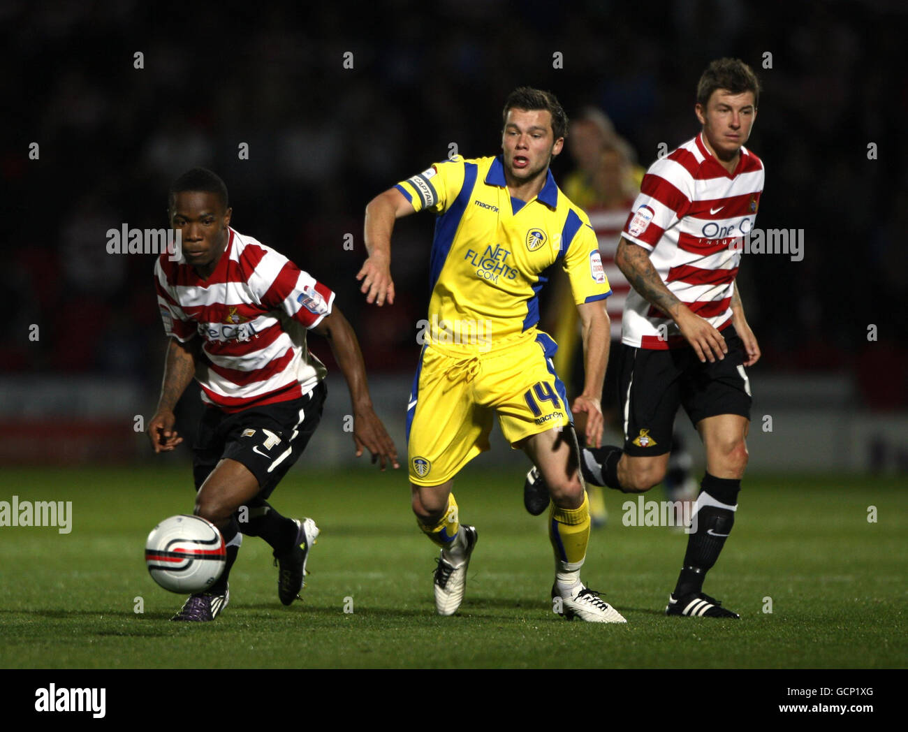 Leeds United captain Jonathan Howson (centre) runs with the ball ...