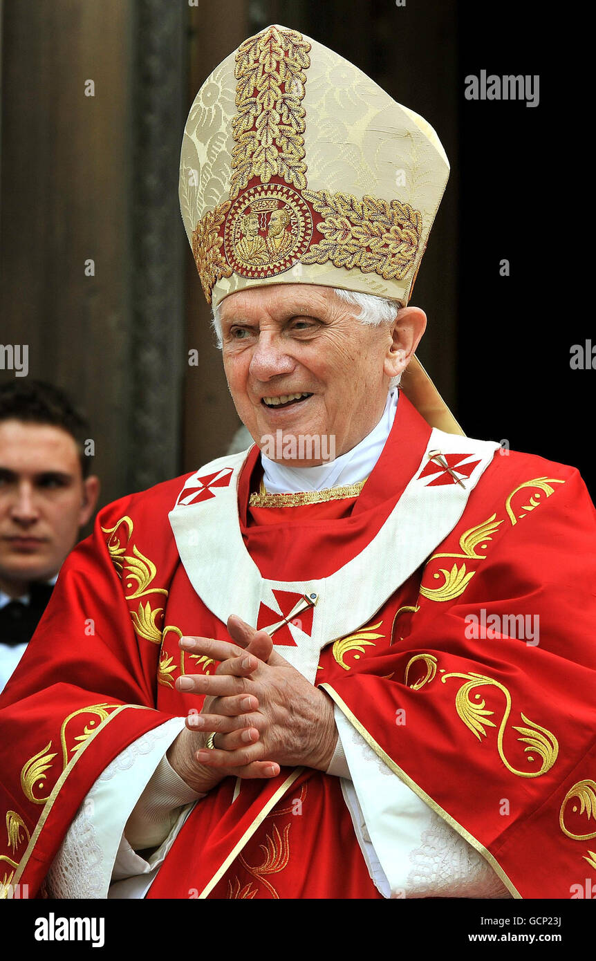Pope Benedict XVI reacts to cheers from the crowd gathered to greet him ...