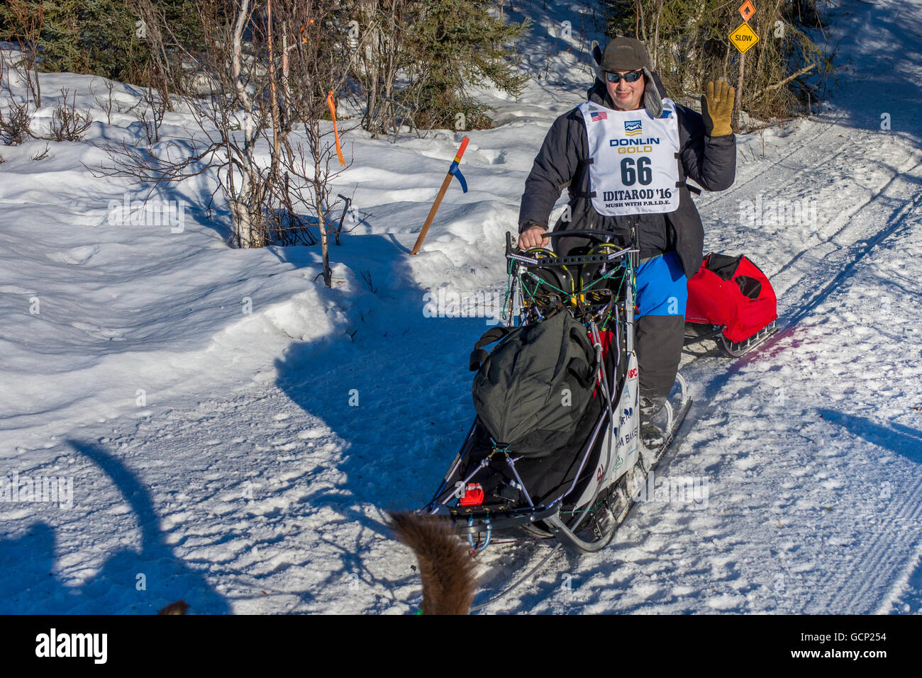 John Baker and team run down the trail on Long Lake shortly after ...