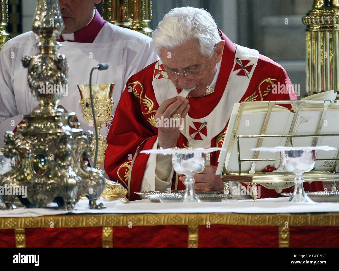 Pope Benedict XVI takes communion as he conducts a mass in Westminster ...
