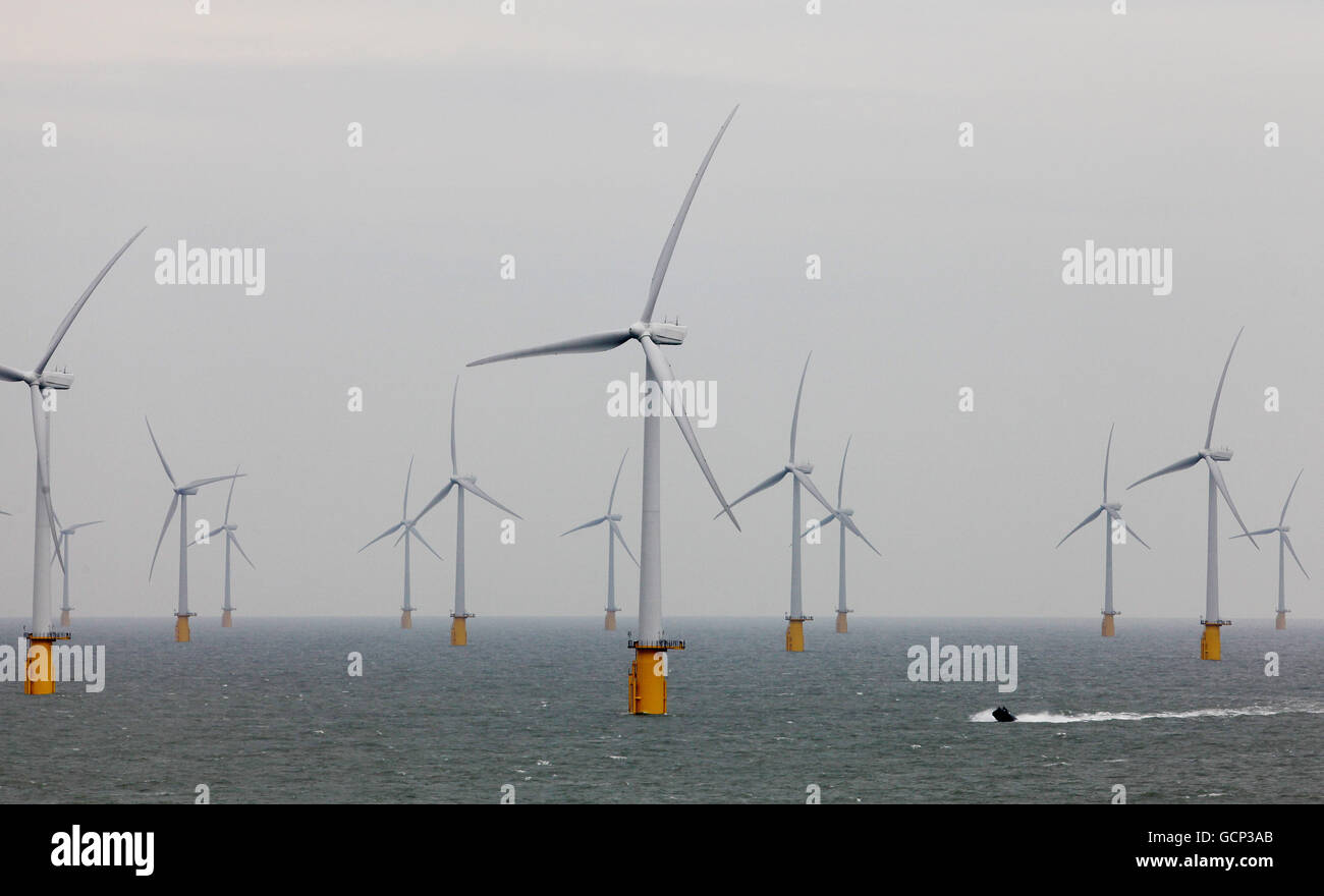 A small boat passes through the windmills of the Thanet Offshore Wind ...