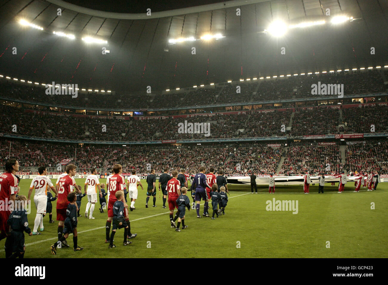 Teams and mascots walk out onto the pitch hi-res stock photography and ...