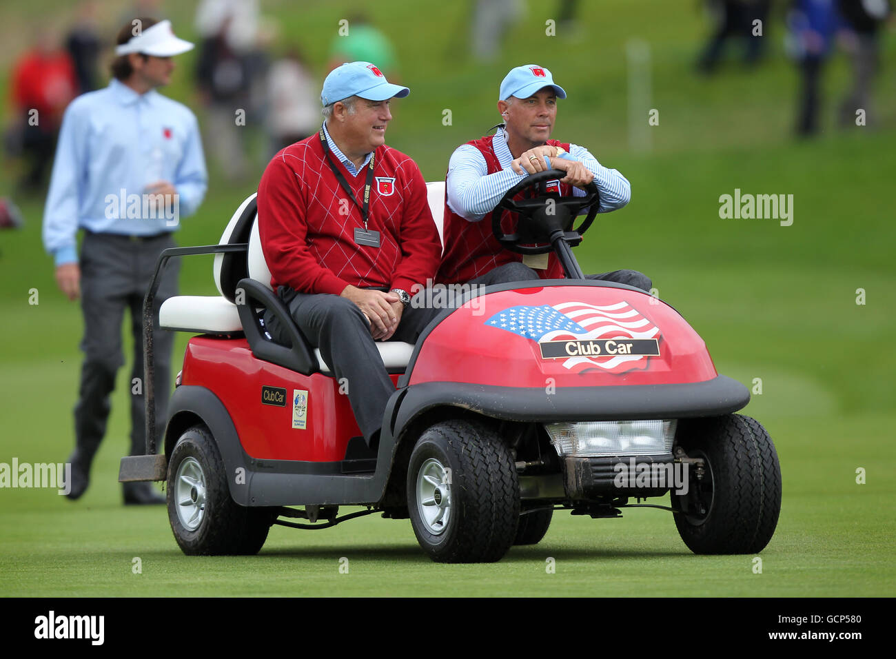 USA's captain Corey Pavin (front right) drives a golf buggy with his ...