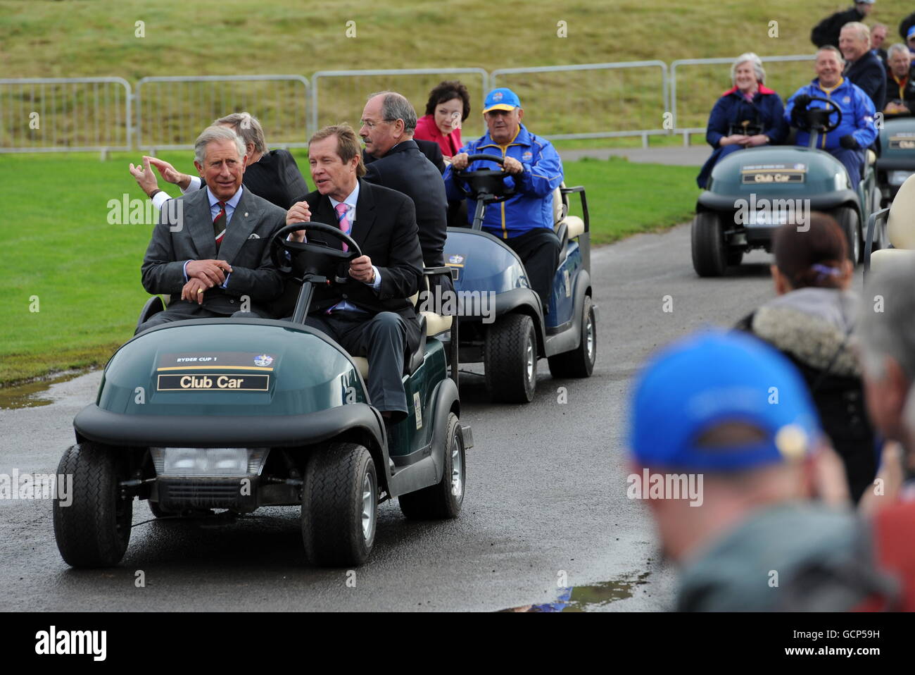 Britain's Prince Charles (left) is driven in a golf buggy by European ...