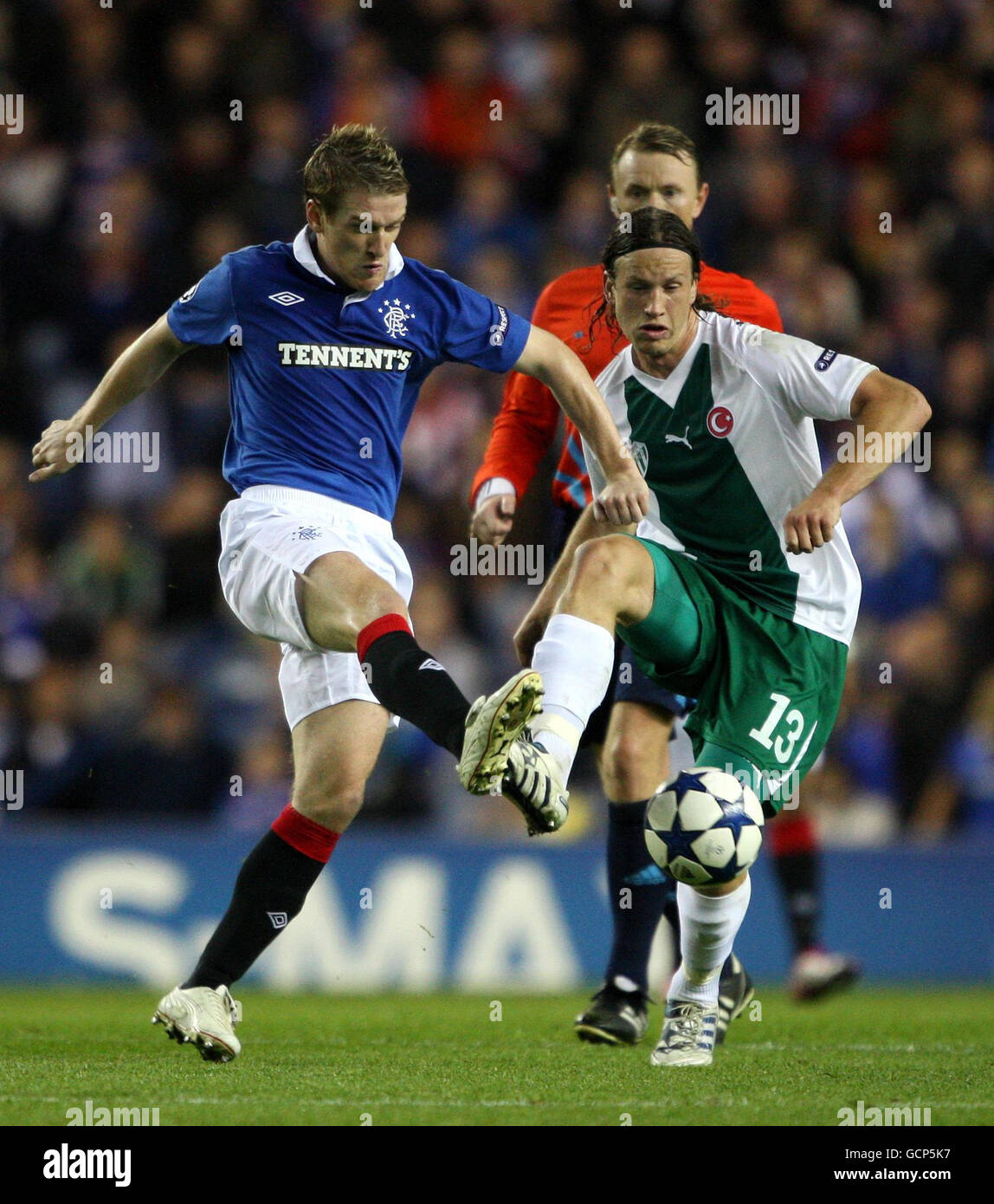Rangers' Steven Davis challenges Bursaspor's Gustav Svensson during the ...