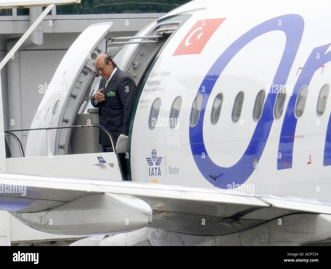 Asil Nadir steps off a plane at Luton Airport after he arrived back in ...