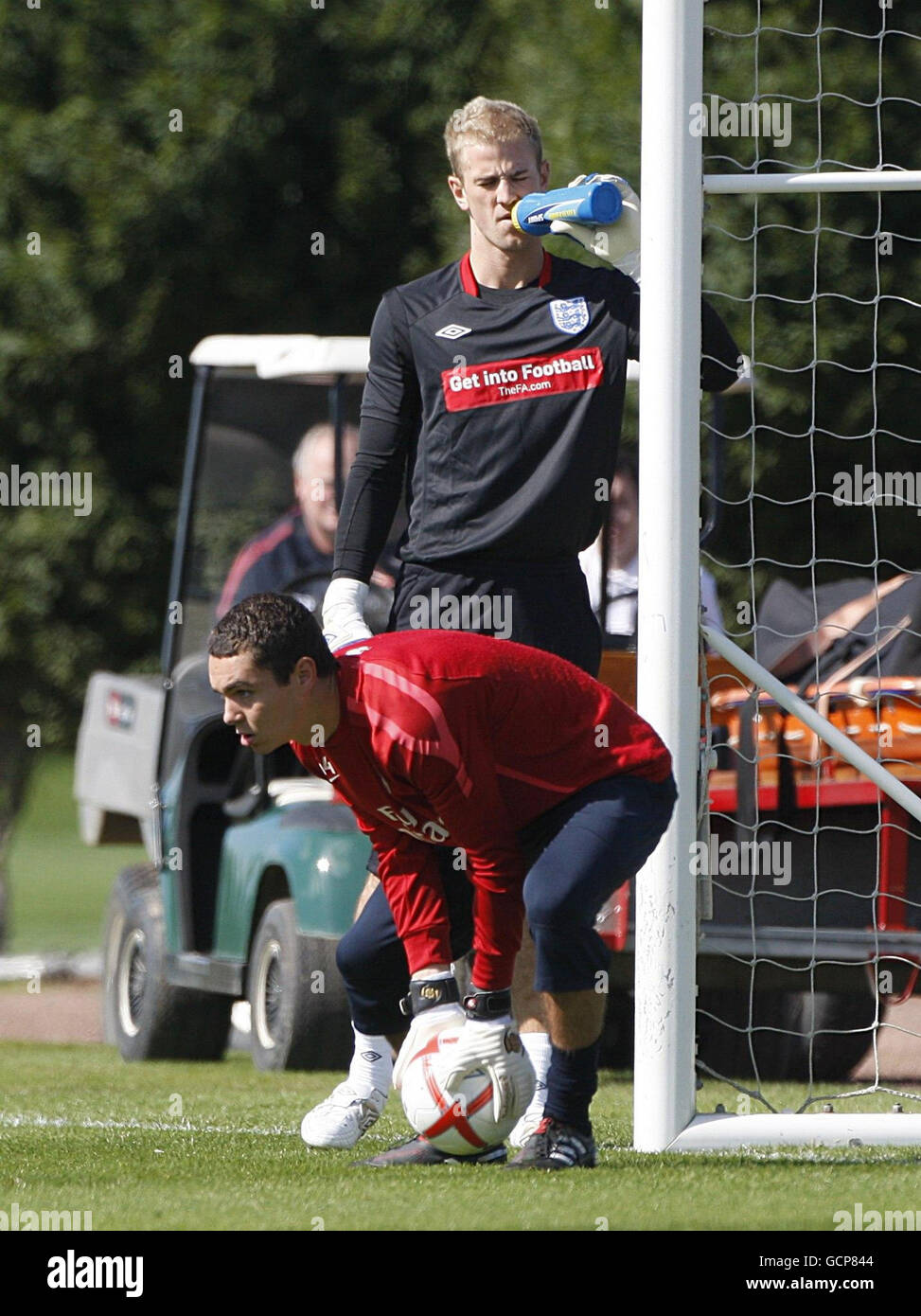 England goalkeeper Joe Hart (back) and Arsenal's James Shea during the ...