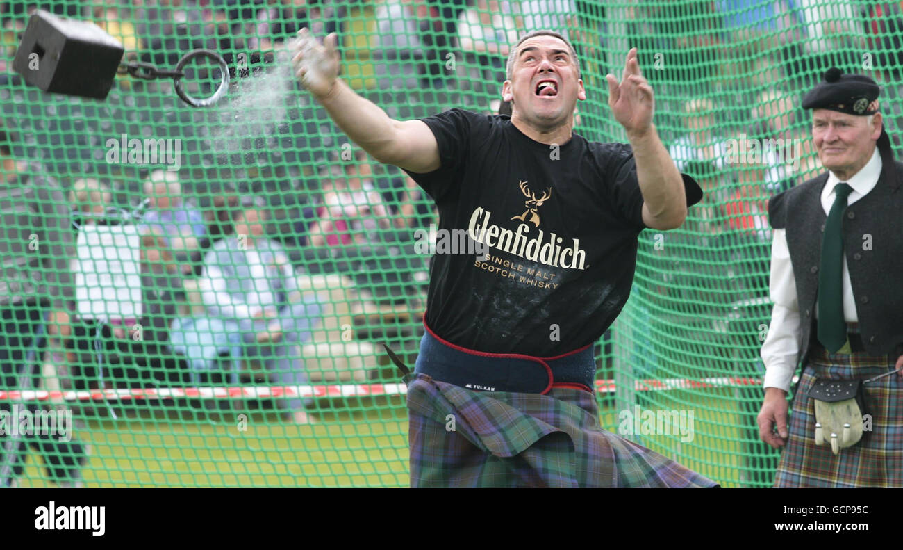 A competitor takes part in the 56 pound weight for distance event in ...