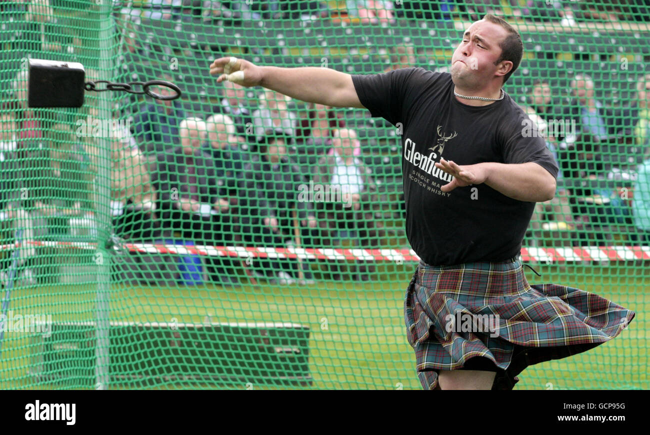 A competitor takes part in the 56 pound weight for distance event in ...