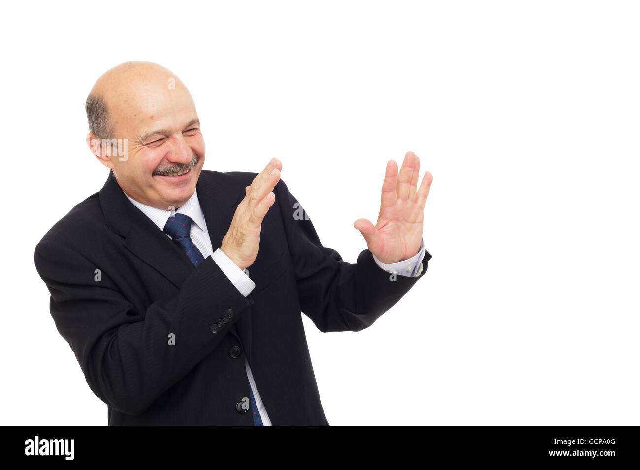elderly man tries to protect himself with his hands, hiding from danger ...