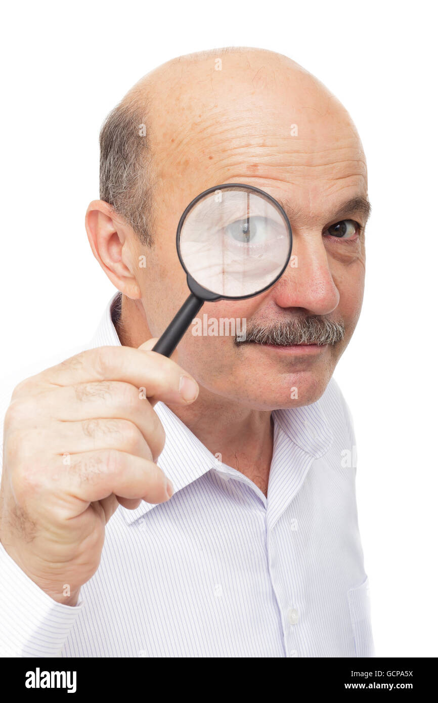 Man scientist looks at something through a magnifying glass Stock Photo ...