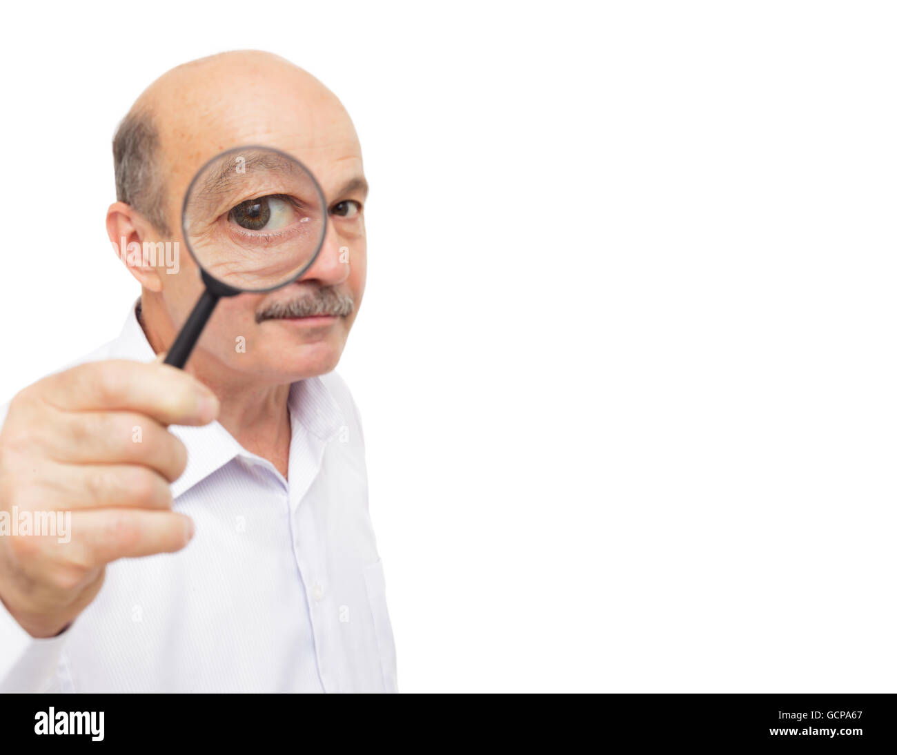 Man scientist looks at something through a magnifying glass Stock Photo ...
