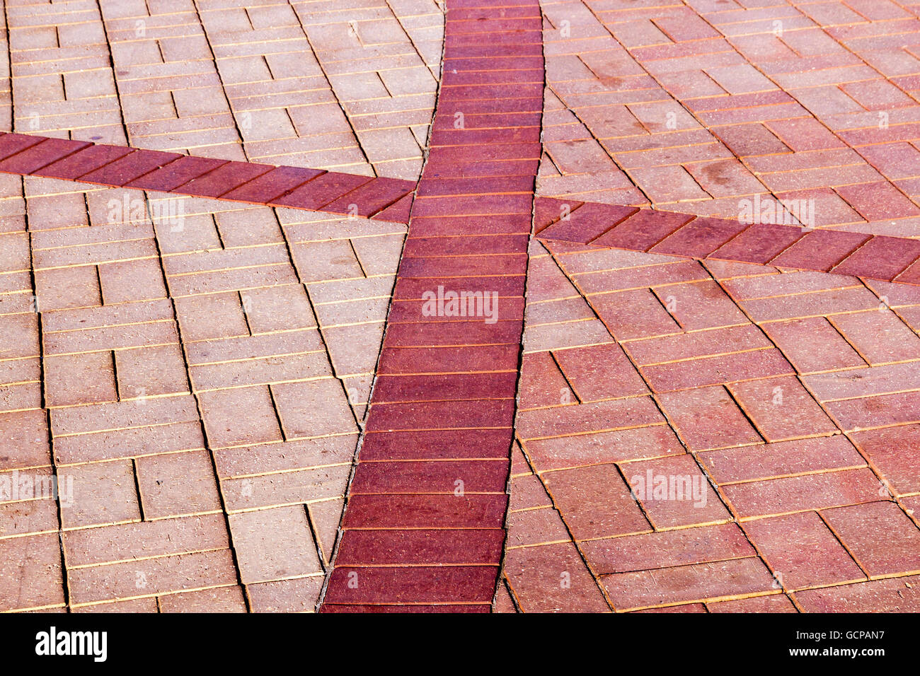 Brick paved promenade background with red cross shape and patterns and ...
