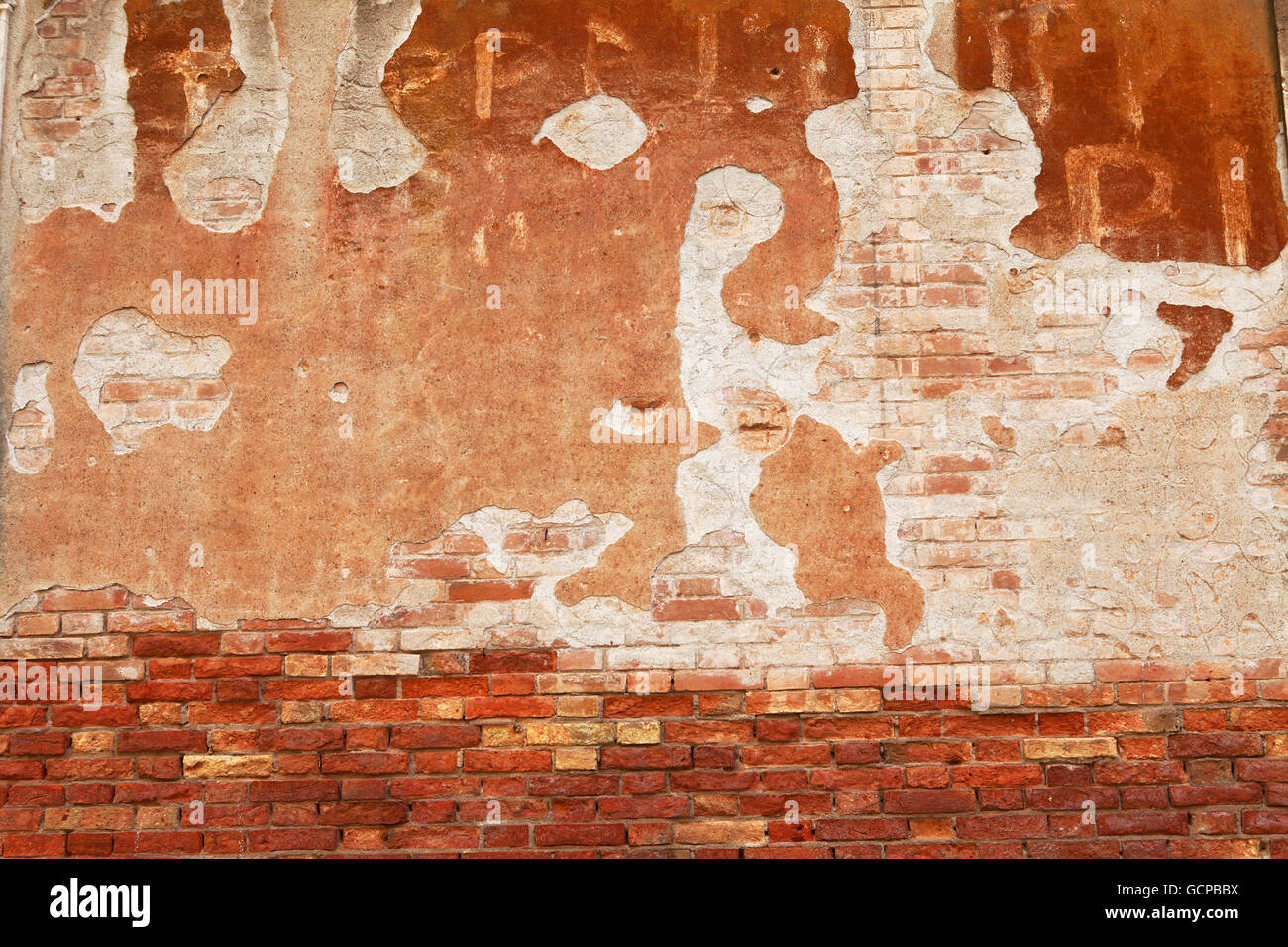Decaying plaster on a city wall creates a threatening image Stock Photo ...