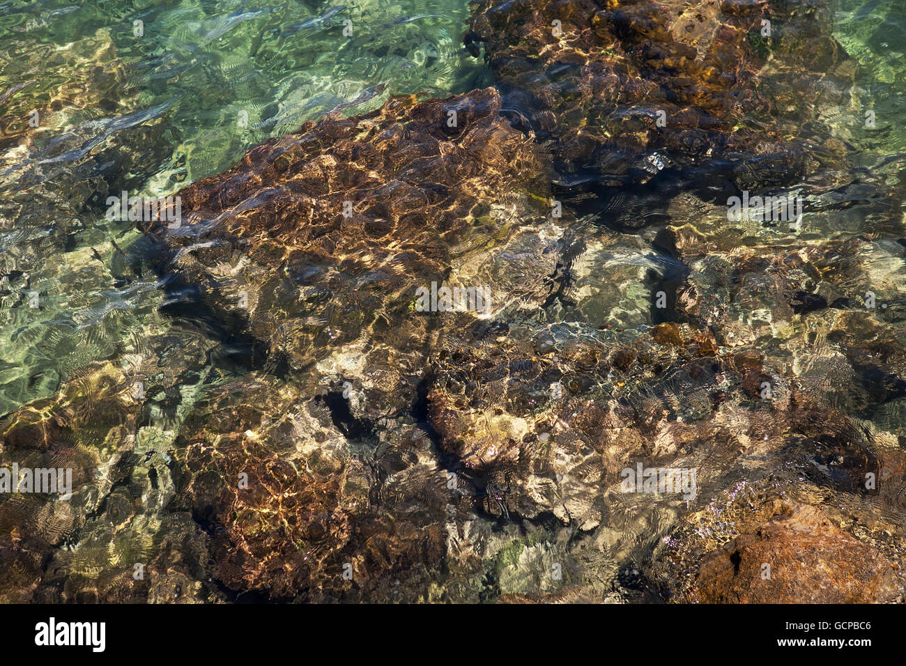 Rocks, Sea and Reflections Stock Photo - Alamy