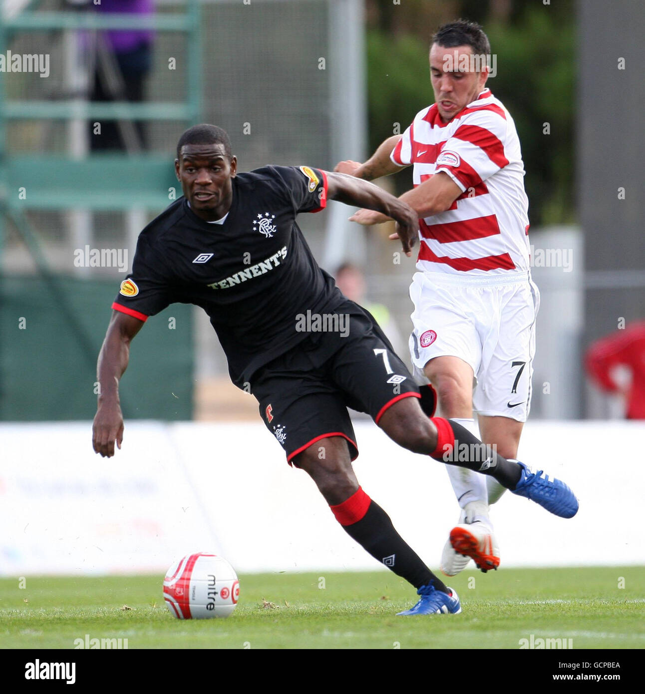 Rangers' Mo Edu and Hamilton's Dougie Imrie (right) during the ...