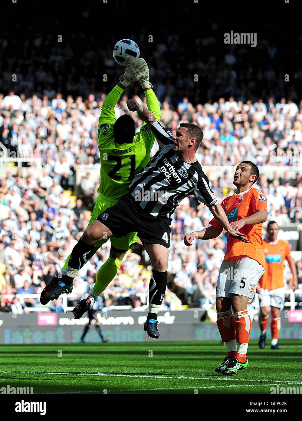 Blackpool goalkeeper Matthew Gilks (left) makes a save from Newcastle ...