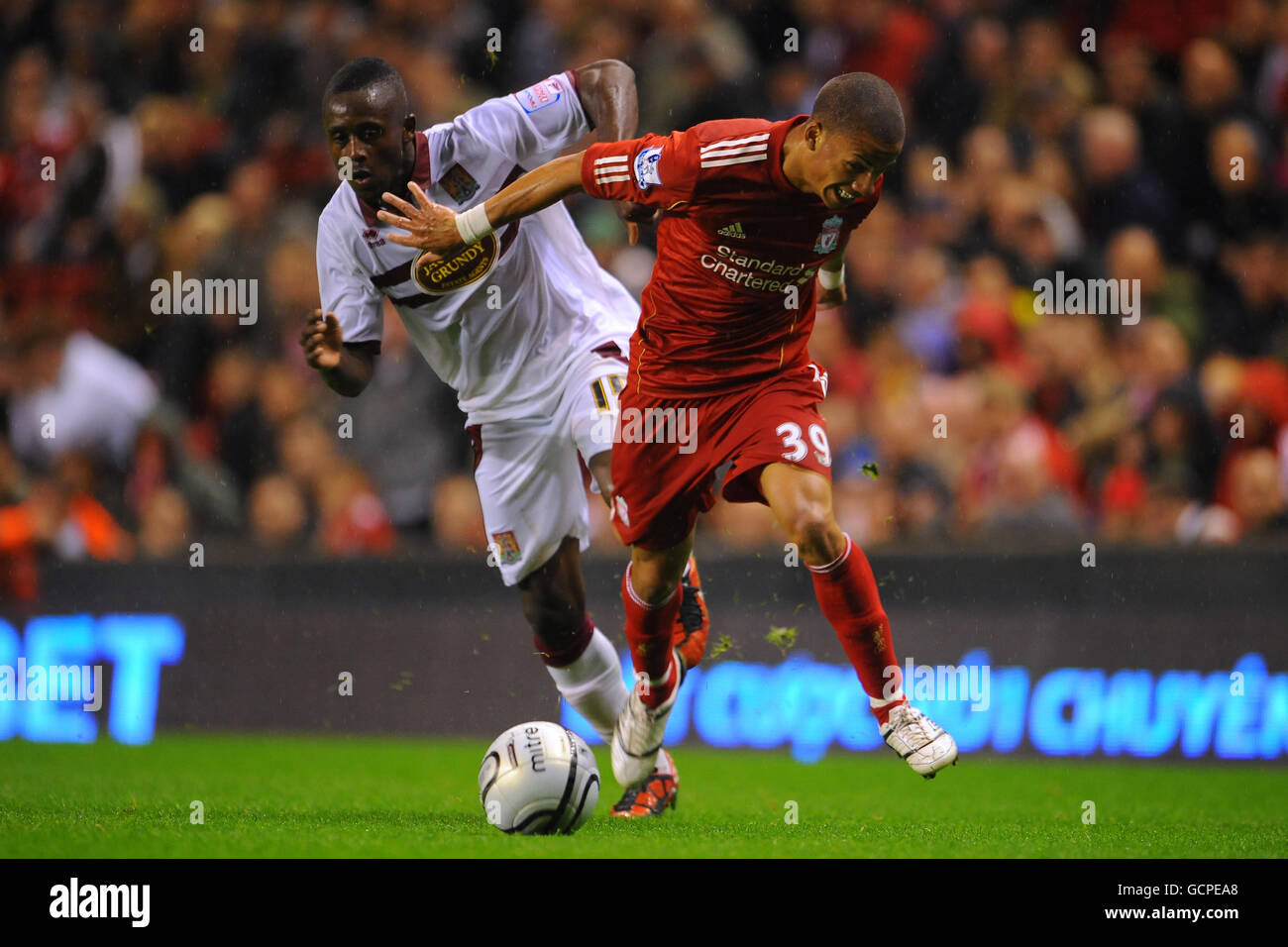Liverpool's Nathan Eccleston (R) and Northampton Town's Courtney ...