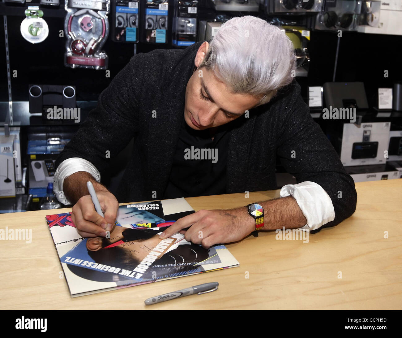 Mark Ronson signing Stock Photo - Alamy