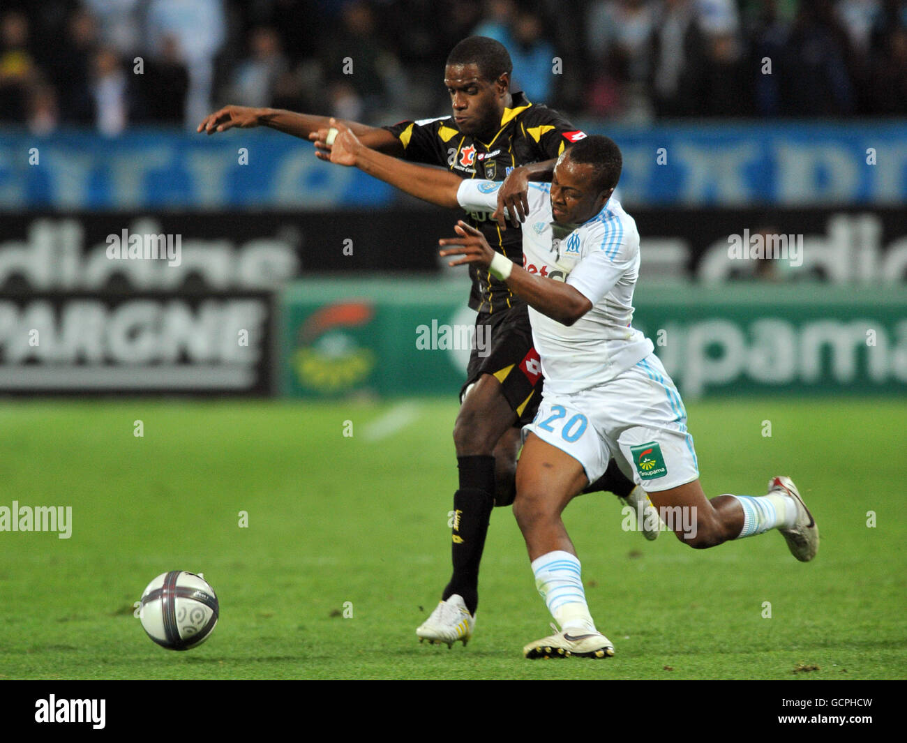 Sochaux's Jacques Faty (left) and Olympique de Marseille's Andre Ayew ...