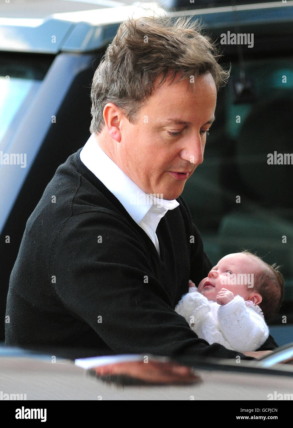 Prime Minister David Cameron with his child Florence and wife Samantha ...