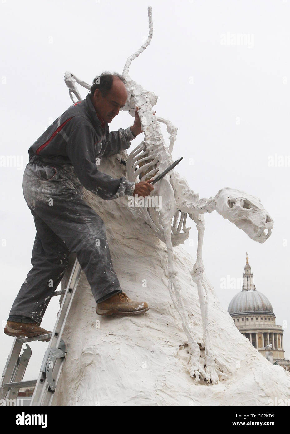 Artist Mark Coreth with his artwork of a life-size tigress on the banks ...