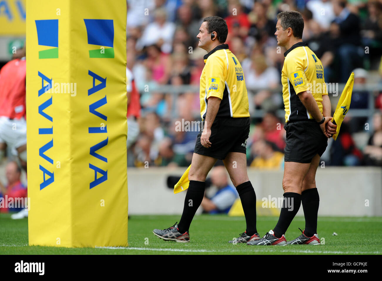 Two touch judges with Stand next to an Aviva branded post protector ...