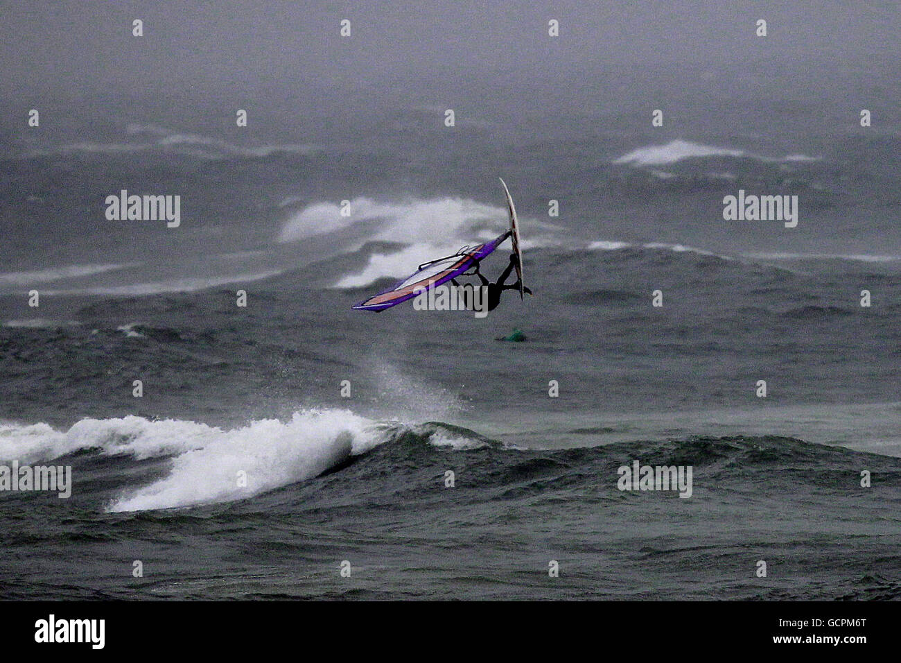 Windsurfers take advantage of heavy seas and high winds off the coast ...