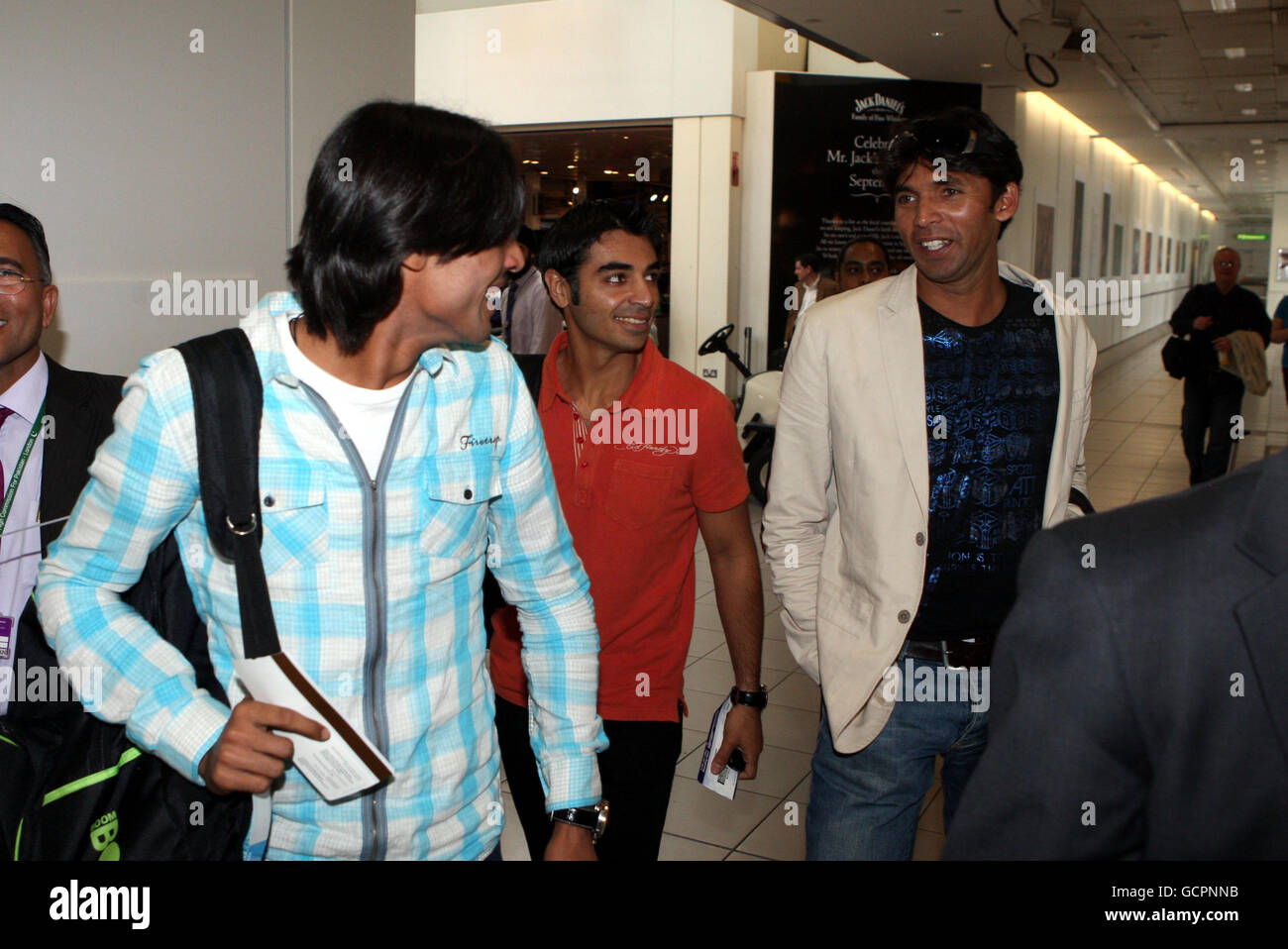 Mohammad Aamer (left), Mohammad Asif and Salman Butt (centre) at Heathrow Airport, London Stock ...