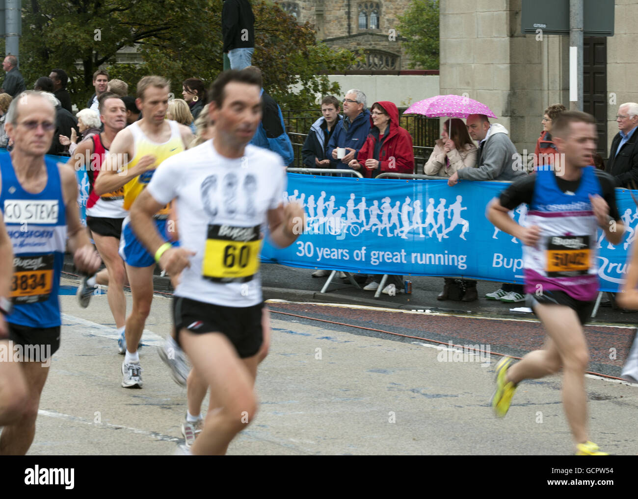 Athletics - BUPA Great North Run - Newcastle. Runners go past a sign ... Athletics - BUPA Great North Run - Newcastle. Runners go past a sign ...