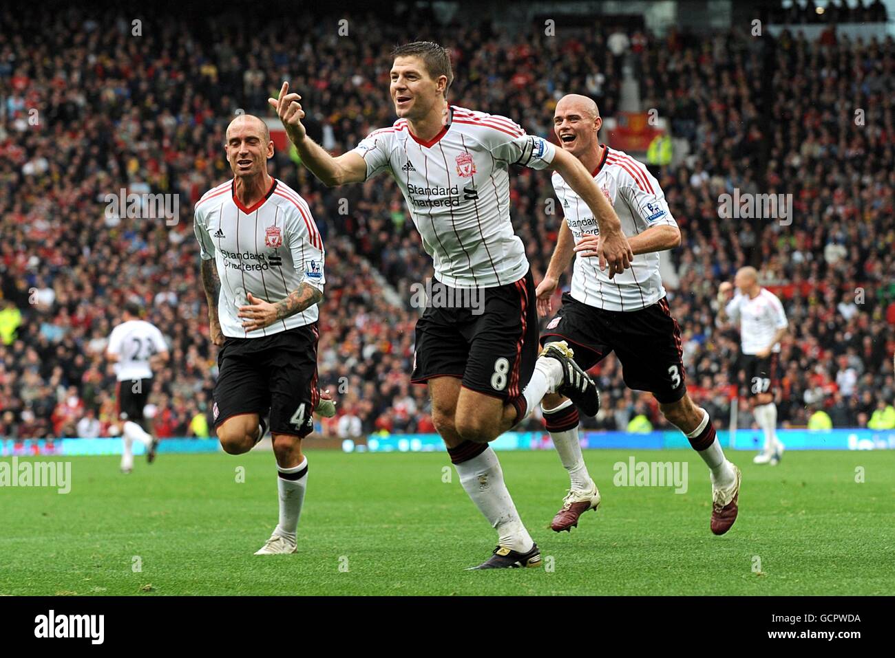Liverpool's Steven Gerrard (centre) celebrates after scoring his side's ...