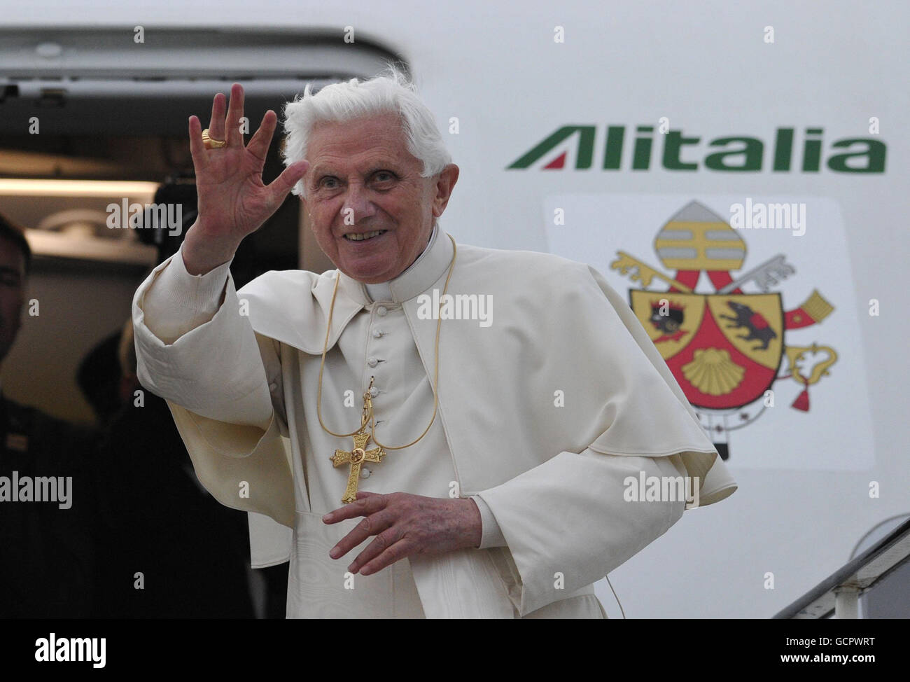 Pope Benedict XVI waves as he boards his aircraft at Birmingham ...