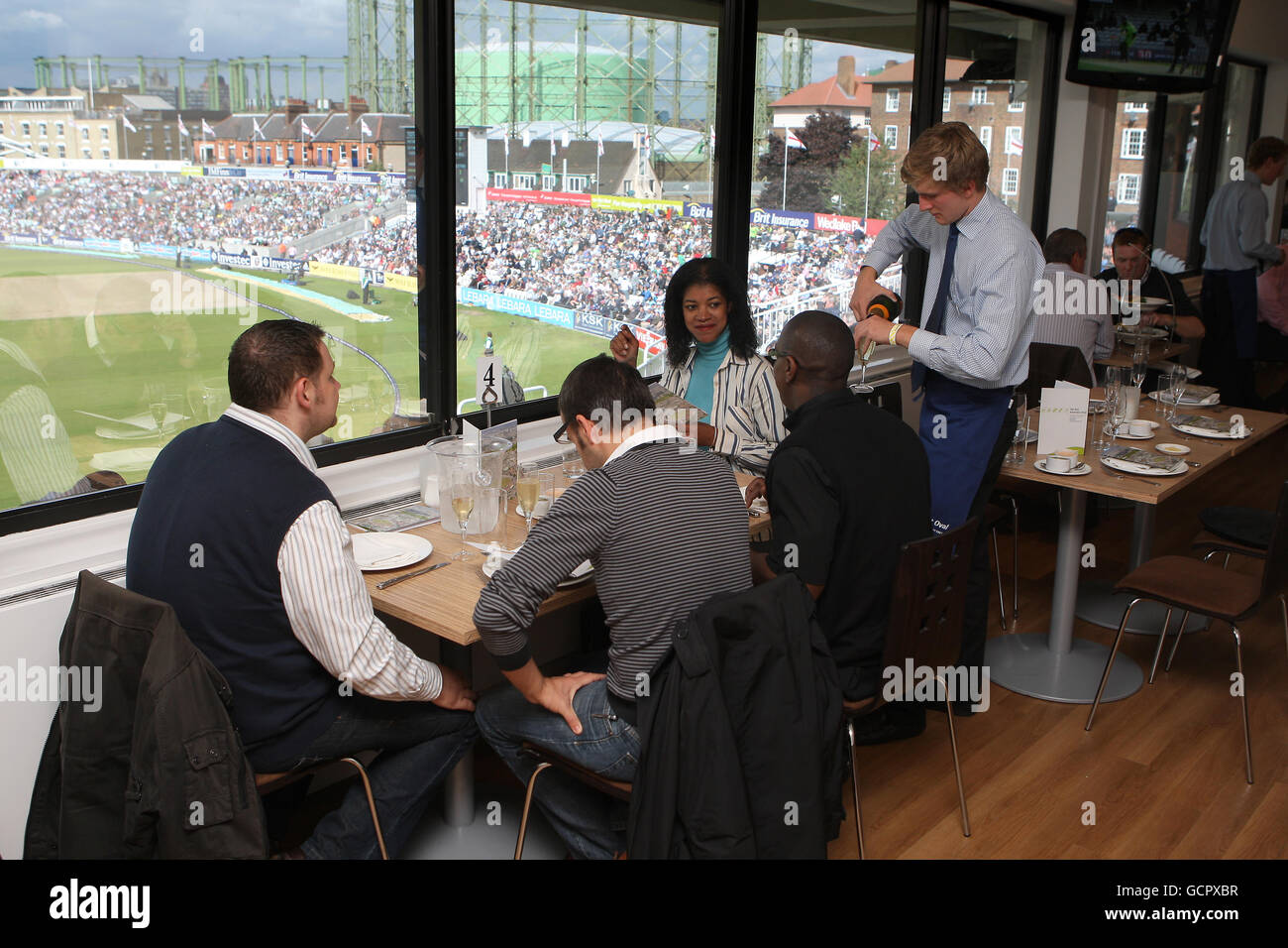 Guests watch the action from the hospitality areas at the Brit ...