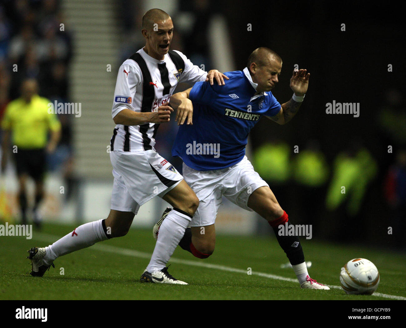 Rangers' Vladimir Weiss (right) challenges Dunfermlines Callum Woods ...