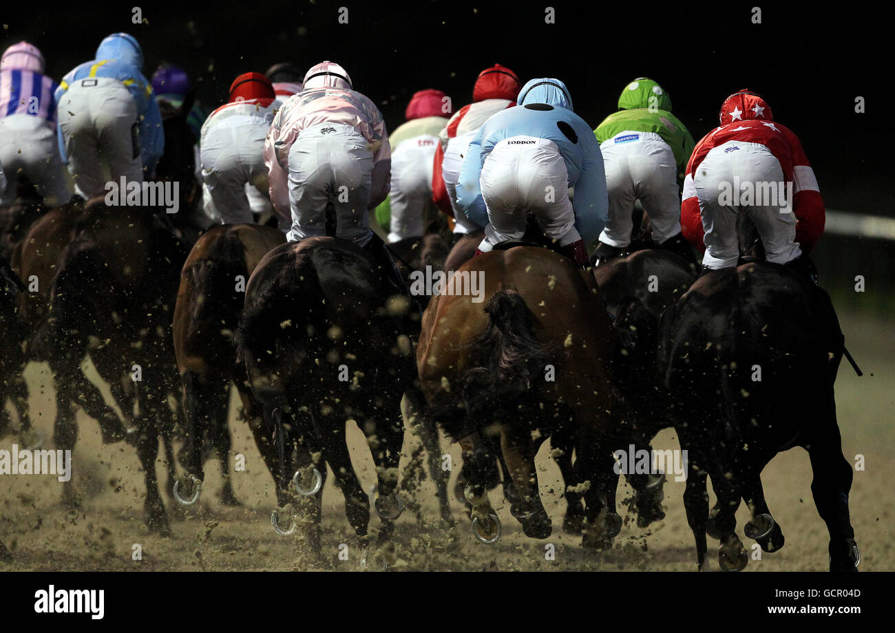 Horse Racing - Wolverhampton Racecourse. Horses go around the first ...