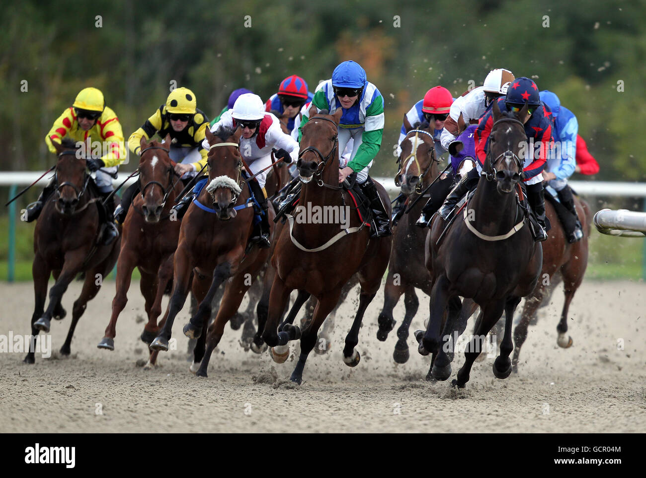 Horse Racing - Wolverhampton Racecourse. Horses go around the last bend ...