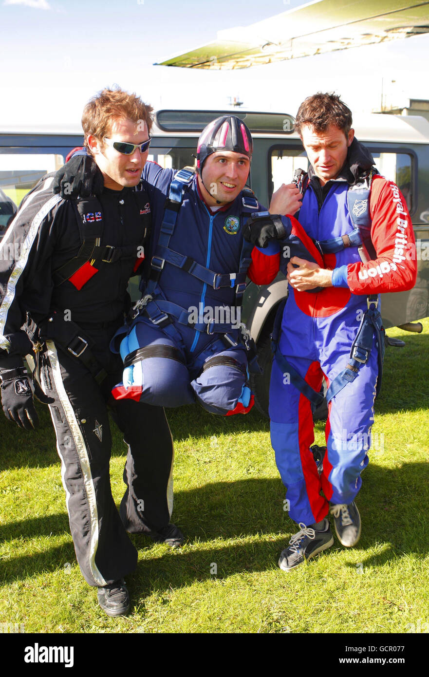Former Army Lance Bombardier Ben Parkinson is helped aboard the ...